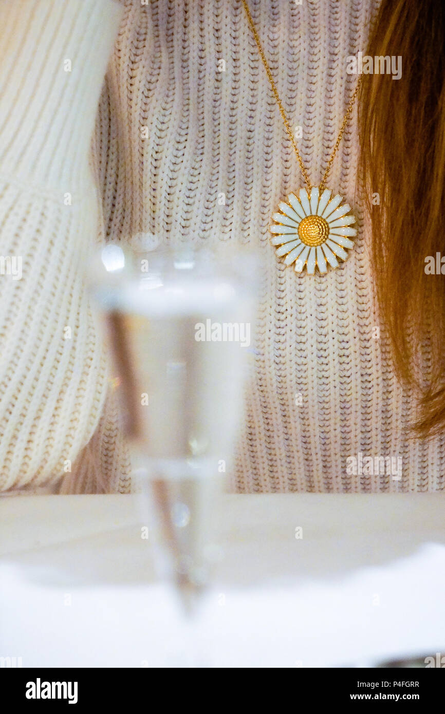 Grappa in akvavit glass, lady in background with Daisy pendant from ...