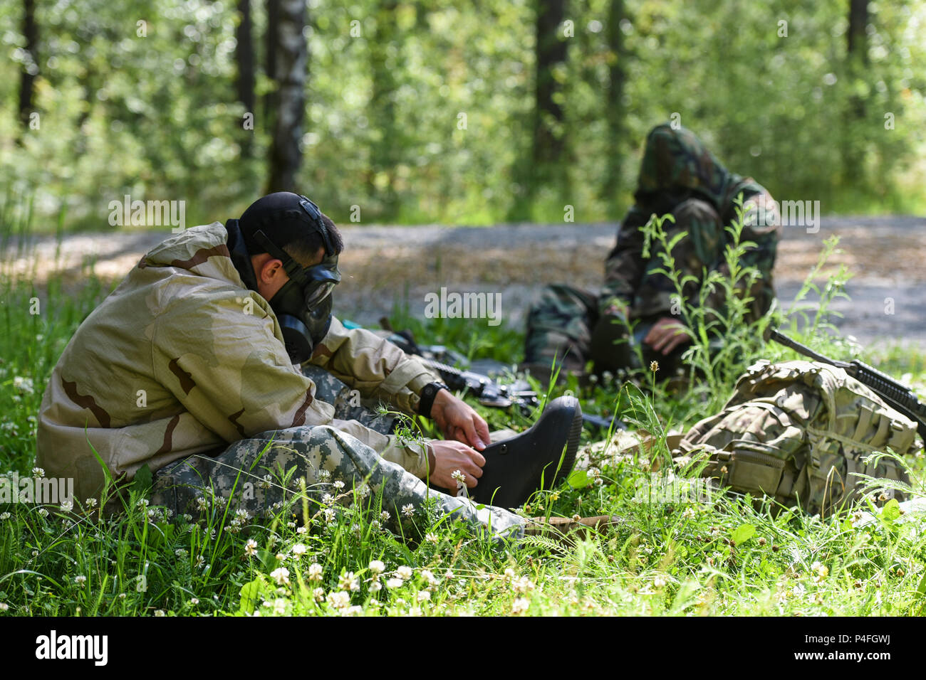 U.S. Soldiers assigned to 7th Army Training Command (7ATC) don their ...