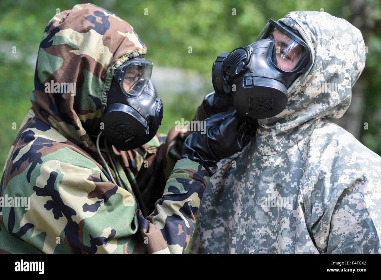 U.S. Army Sgt. 1st Class Charles DeClouette, left, with Combined Arms ...