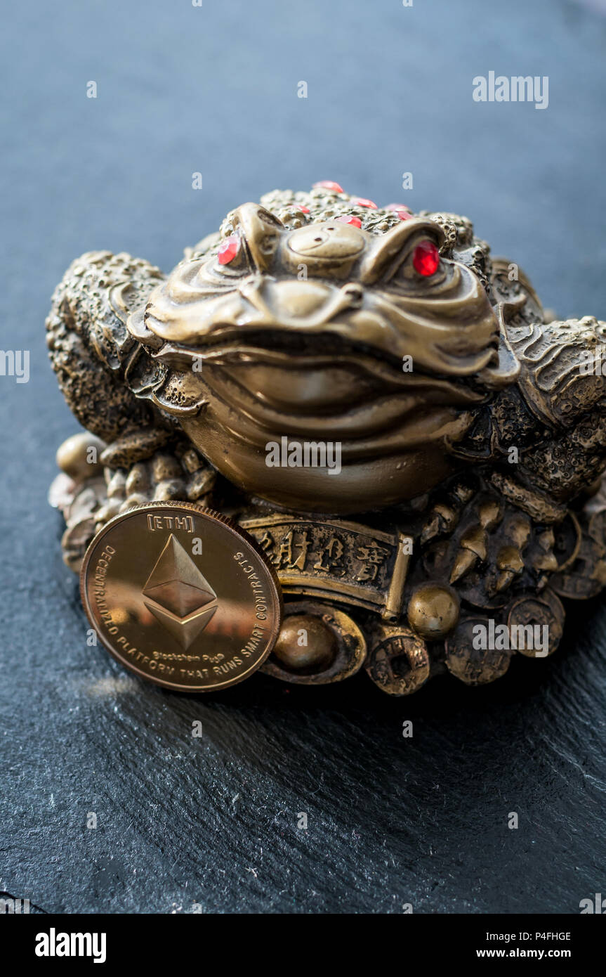 Chinese toad good luck with the Ethereum gold coin in your mouth Stock ...