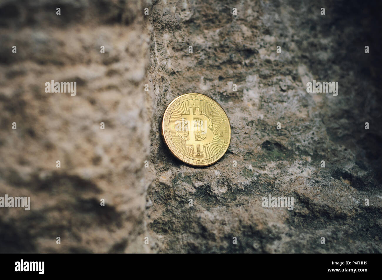 bitcoin mining golden coin of bitcoin on rock background Stock Photo ...