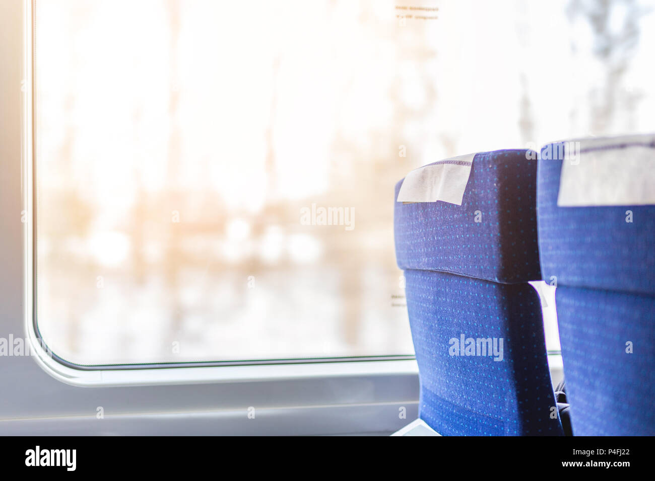 Interior of modern intercity express train. Back view of wide ...