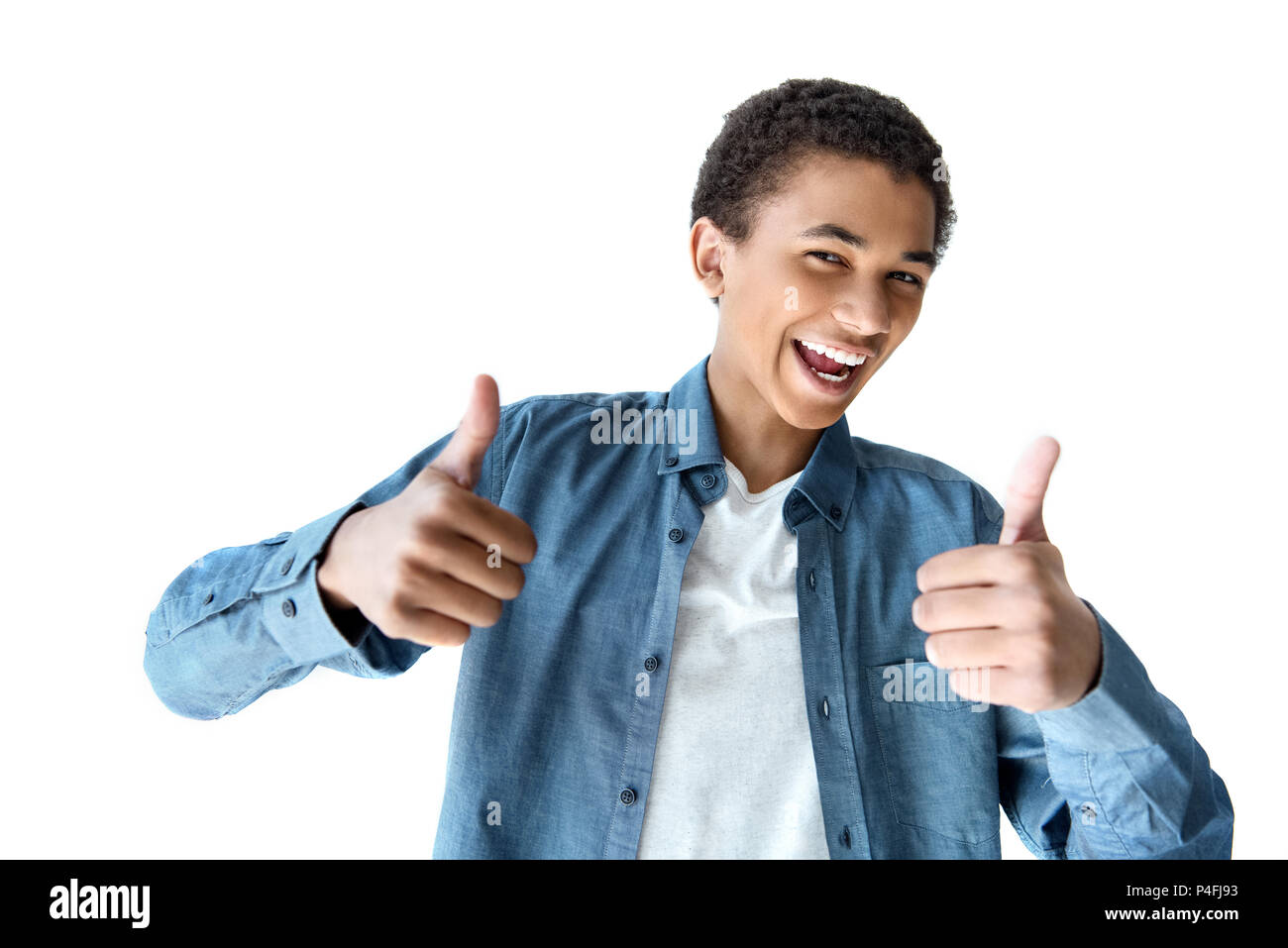 portrait of excited african american teenager showing thumbs up ...