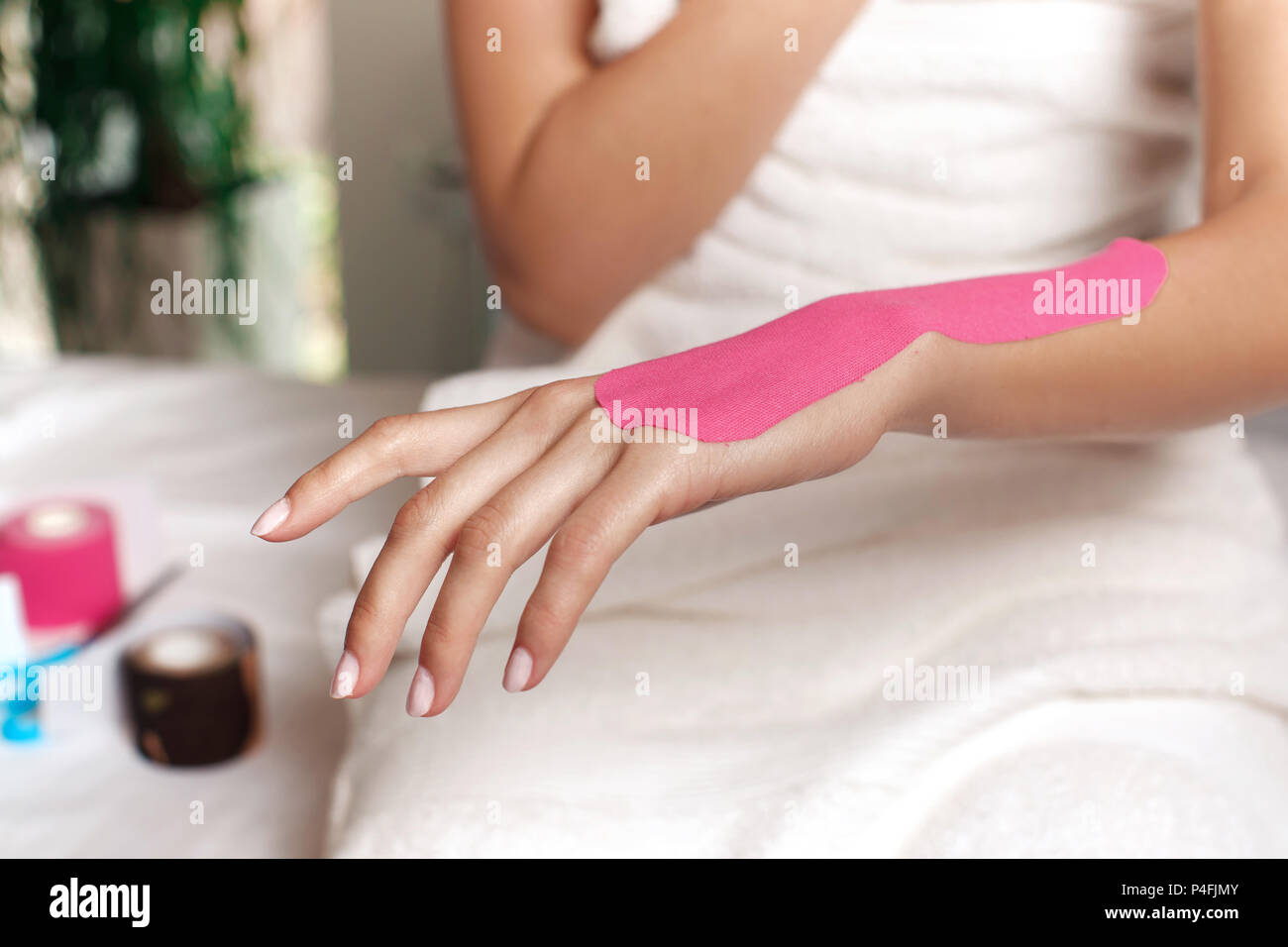 woman wearing kinesio therapy tape Stock Photo - Alamy