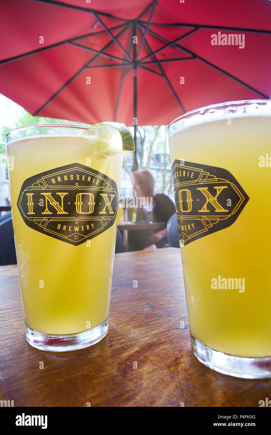 Two pints of wheat beer on a table at the Inox pub on Grande Allée in ...