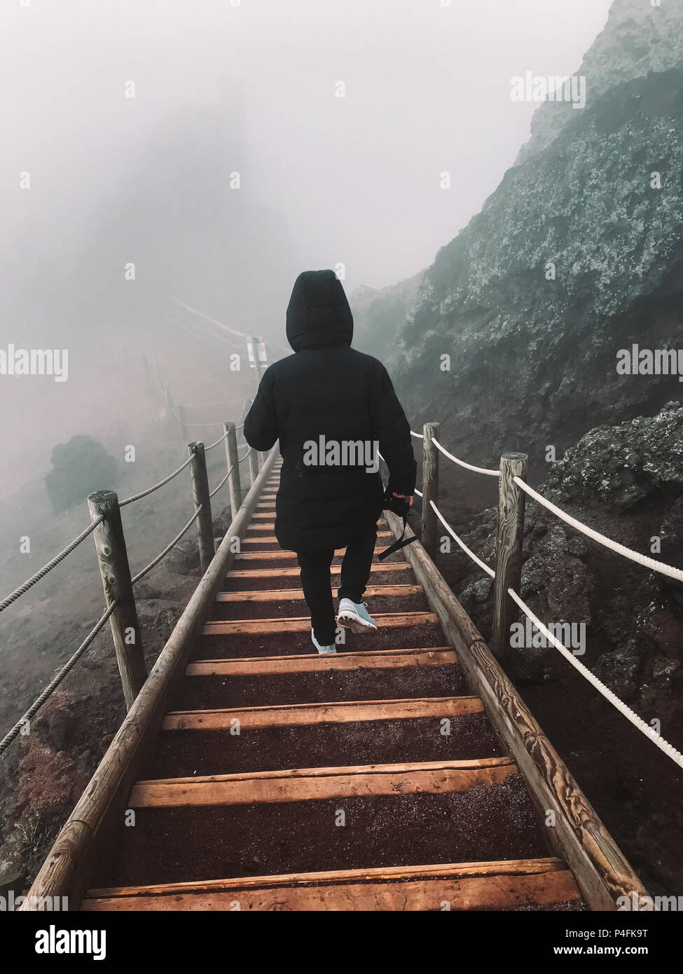 Man on the stairs railing Stock Photo - Alamy