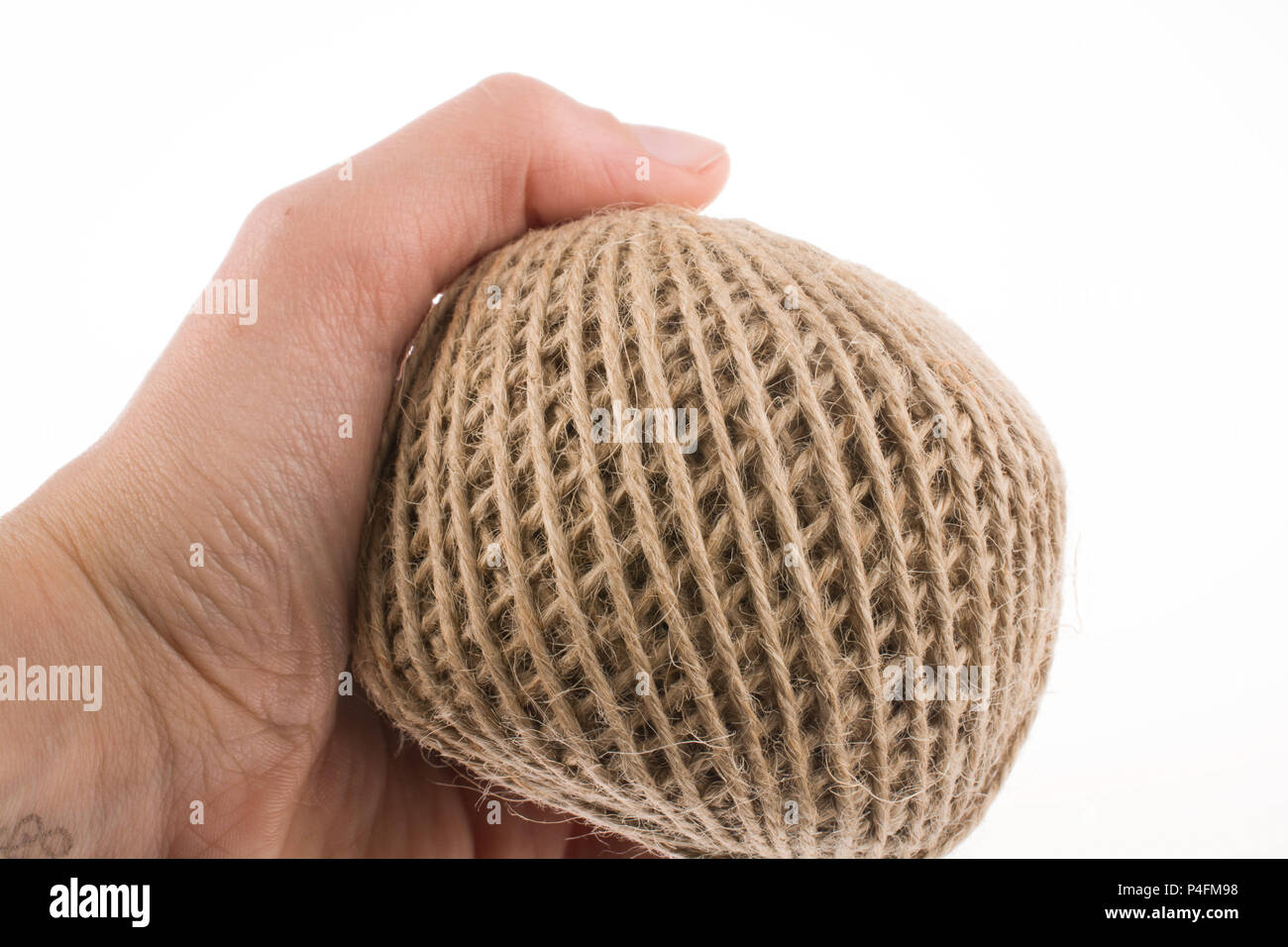 Roll of brown color linen string on a white background Stock Photo - Alamy