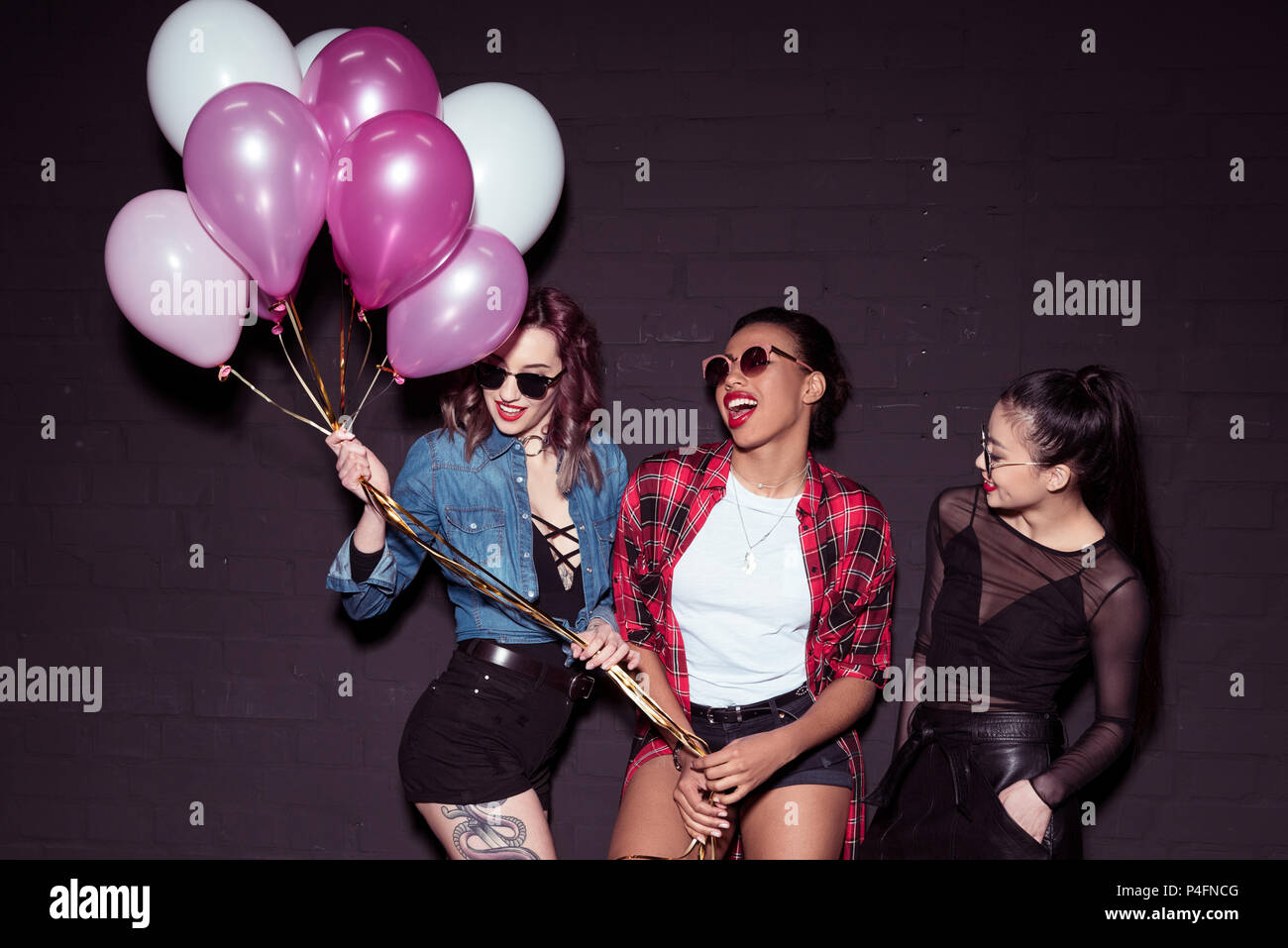 multicultural stylish young women with balloons have fun at party Stock ...