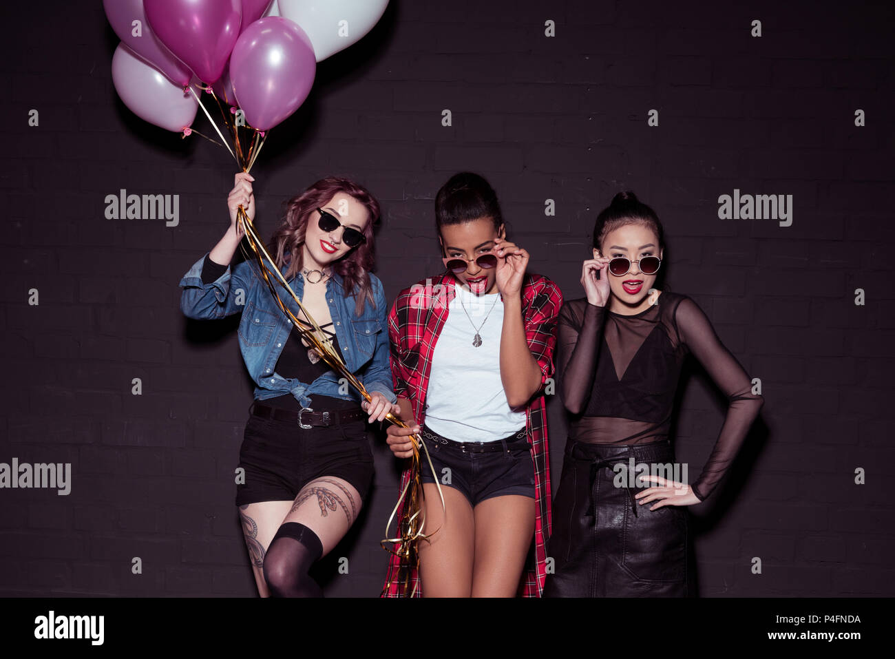multicultural stylish young women with balloons have fun at party Stock ...