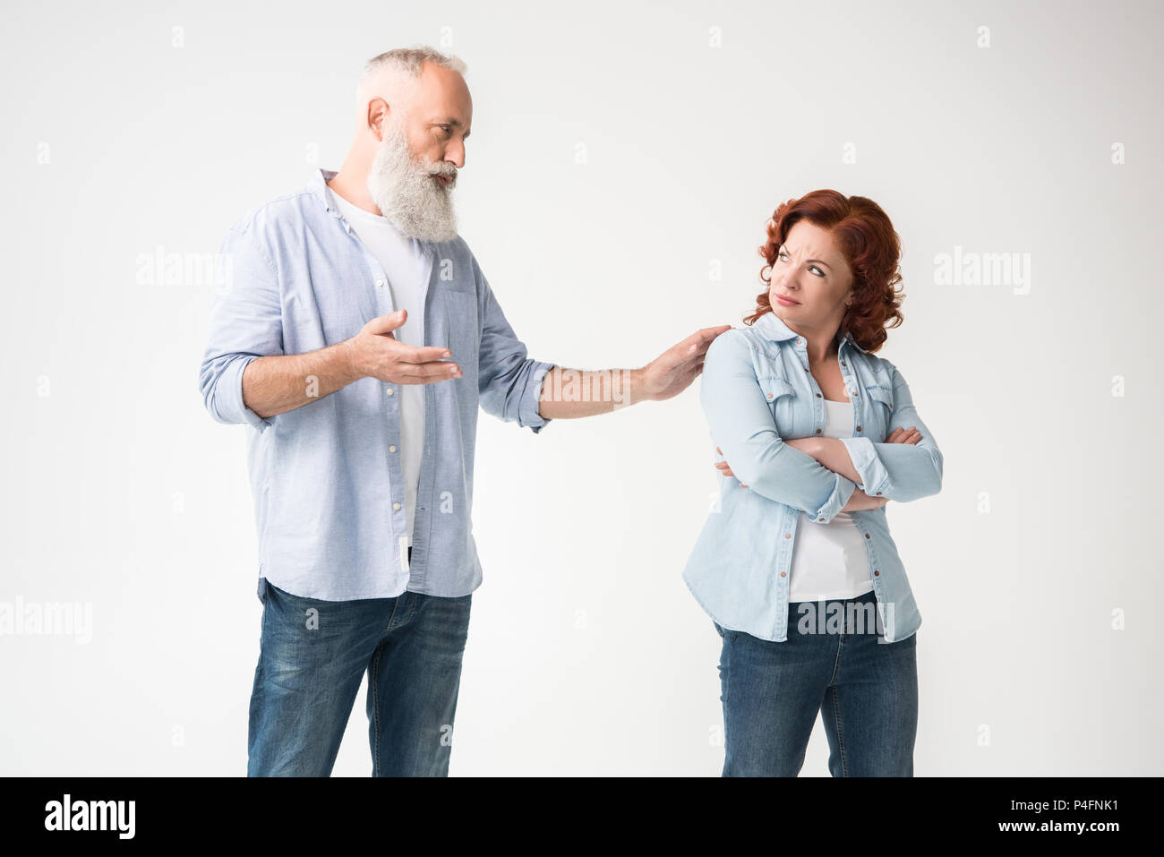 dissatisfied mature couple, isolated on white Stock Photo - Alamy