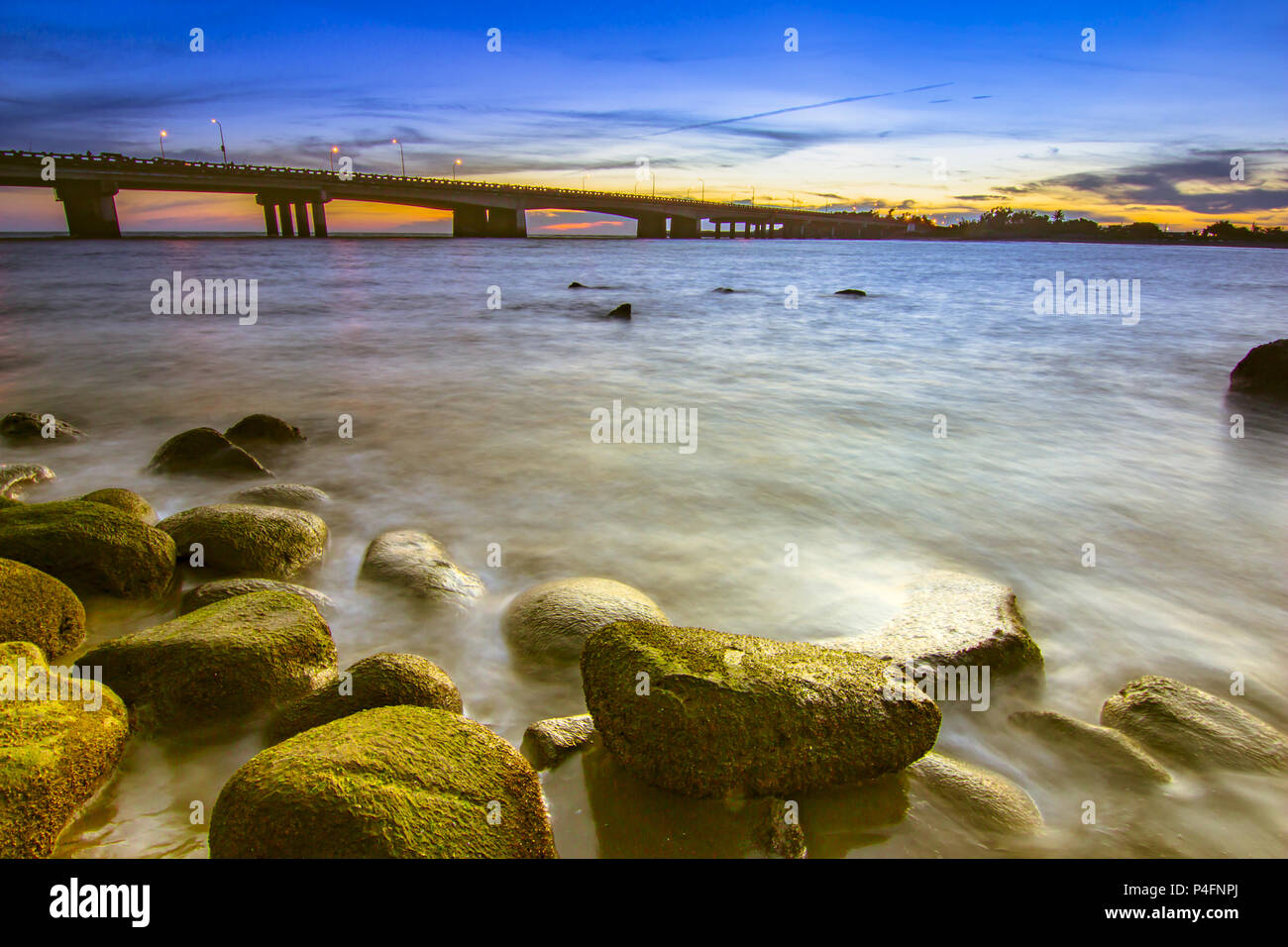 Coast Sunset and bridge Stock Photo - Alamy