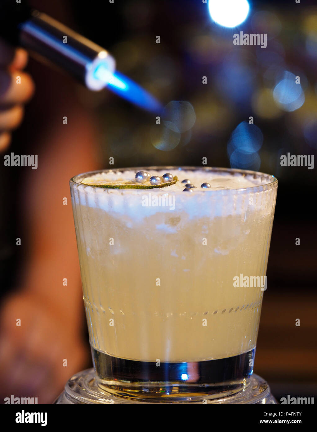 Preparation of a cocktail with flame at the bar Stock Photo - Alamy