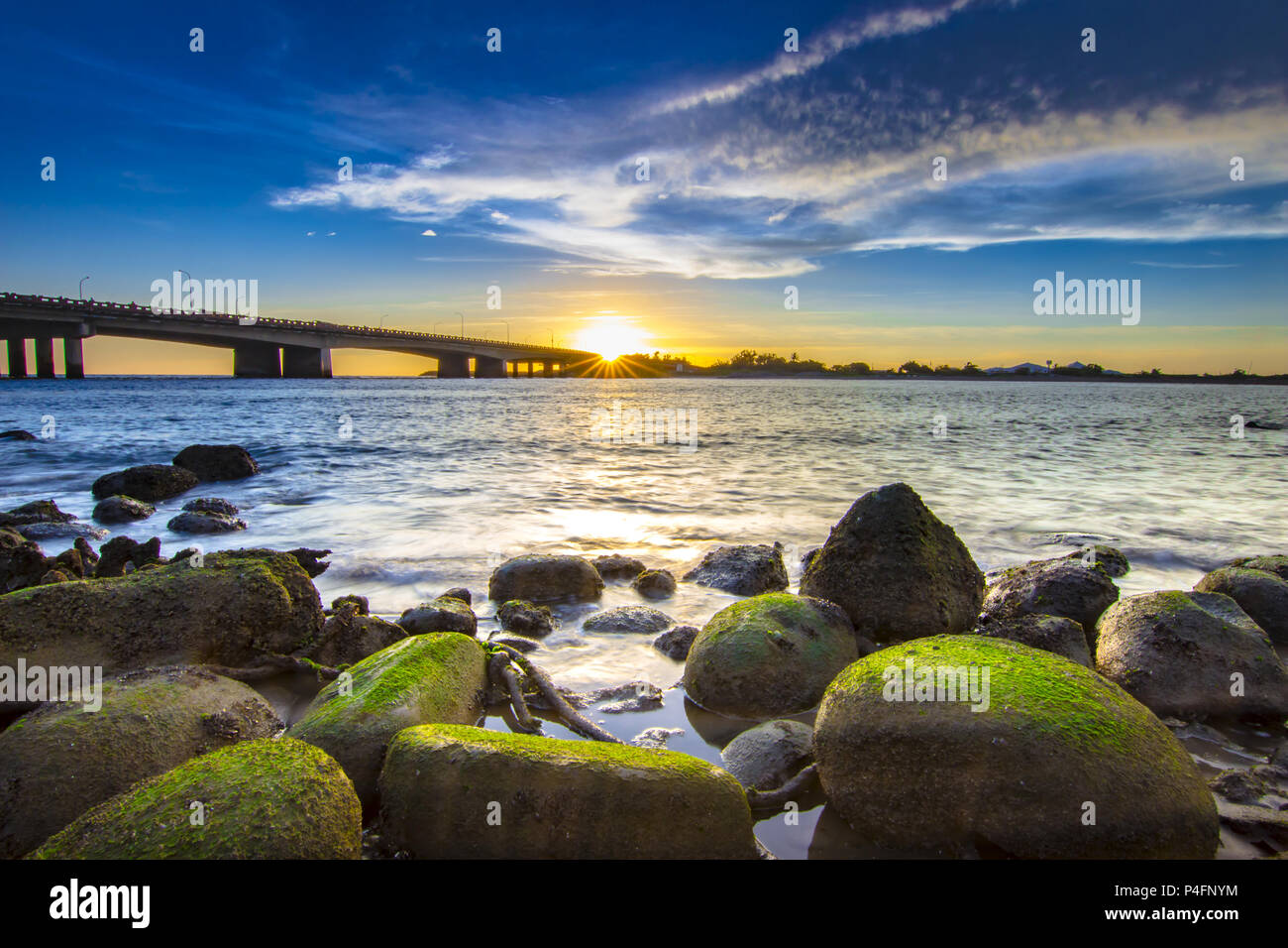 Coast Sunset and bridge Stock Photo - Alamy