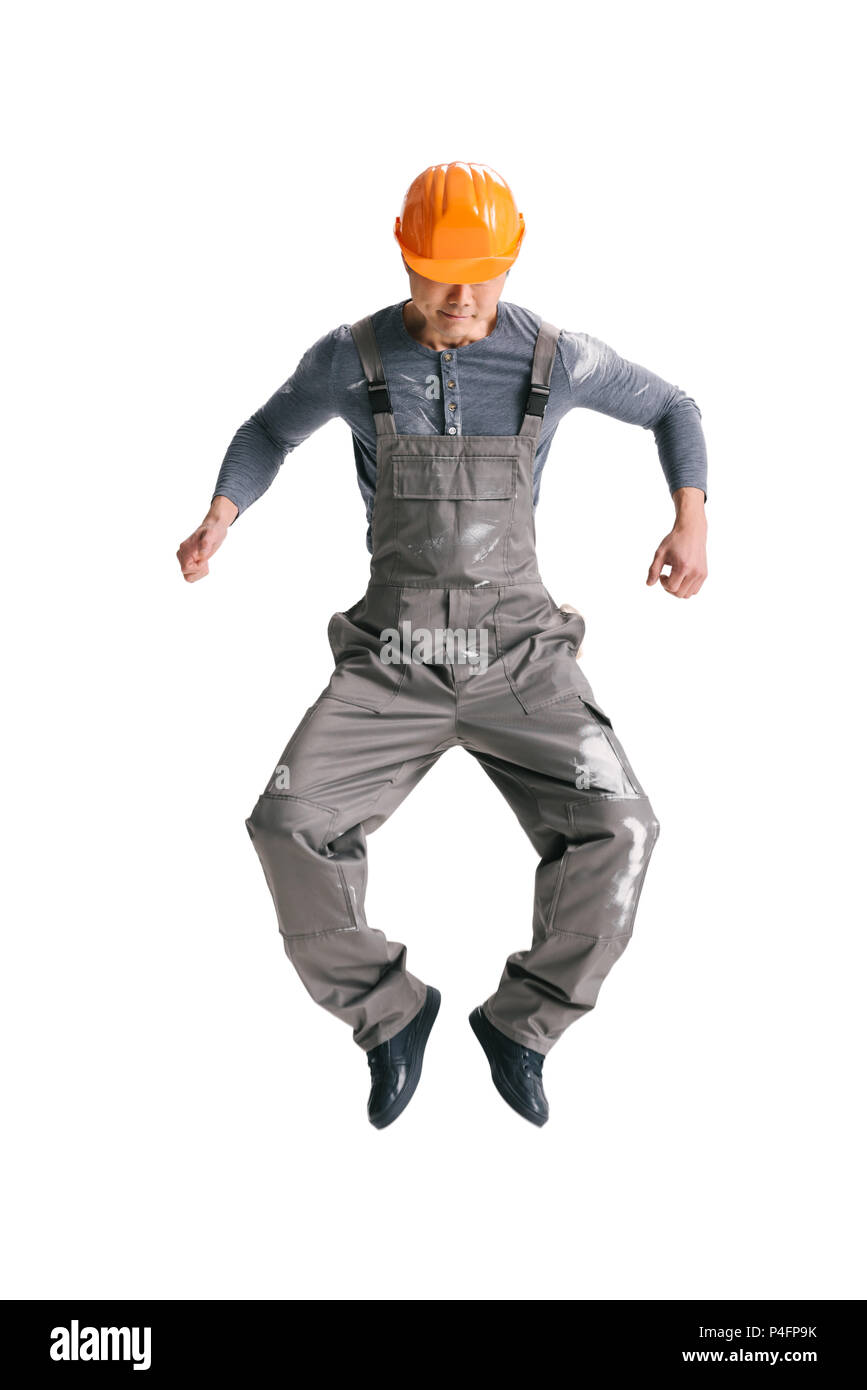 asian construction worker in overall jumping isolated on white Stock ...