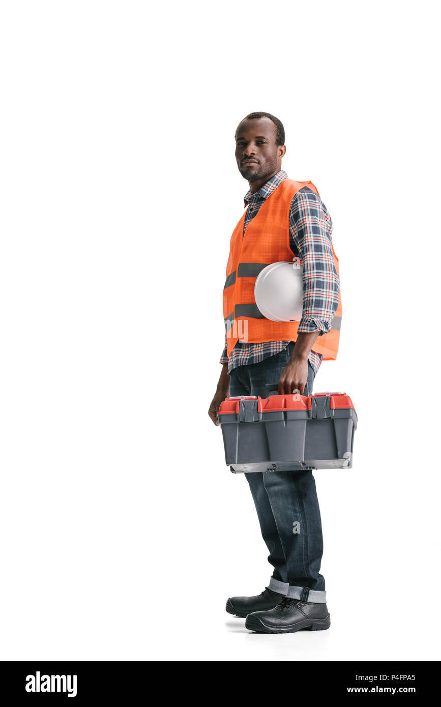 pensive african-american construction worker with toolbox isolated on ...