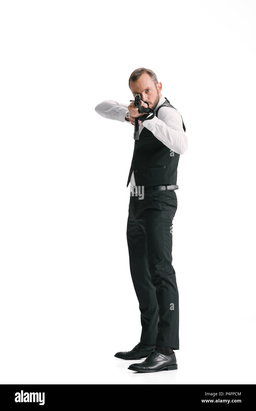 secret agent in suit with rifle aiming at camera isolated on white ...