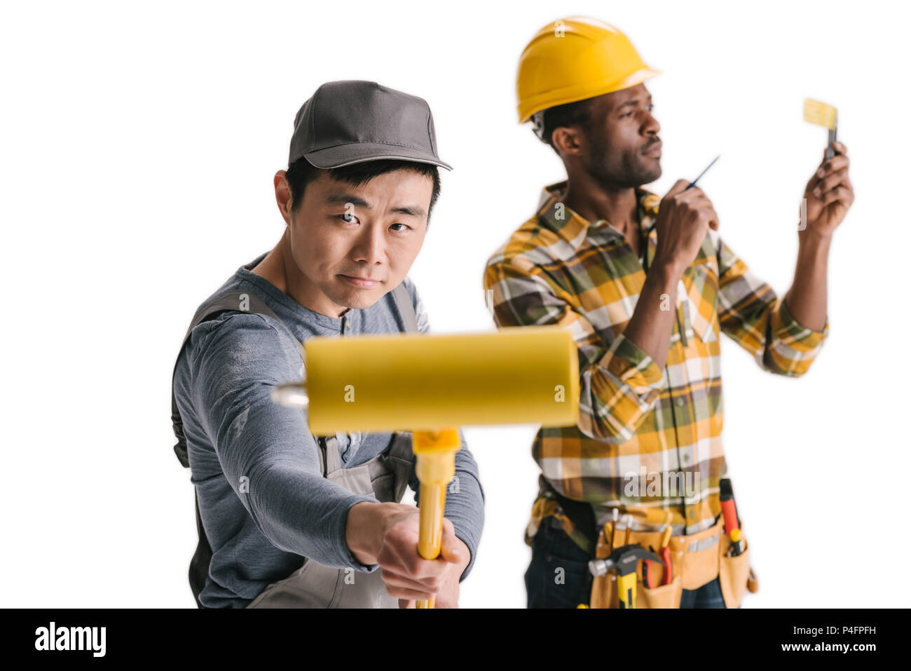 african-american and asian construction workers with tools isolated on ...