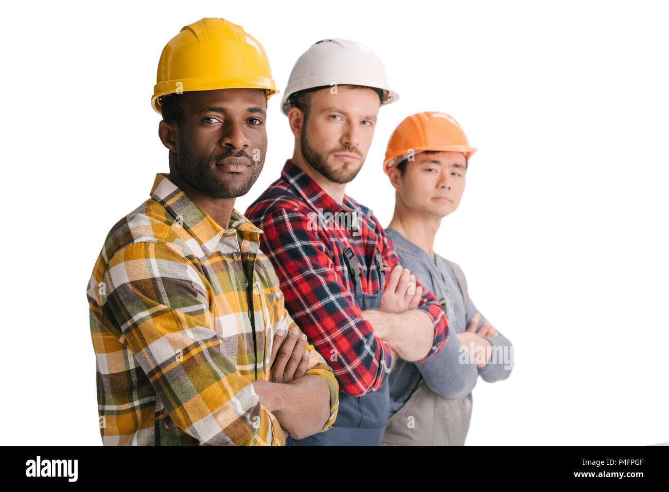 group of multiethnic construction workers in row looking at camera ...