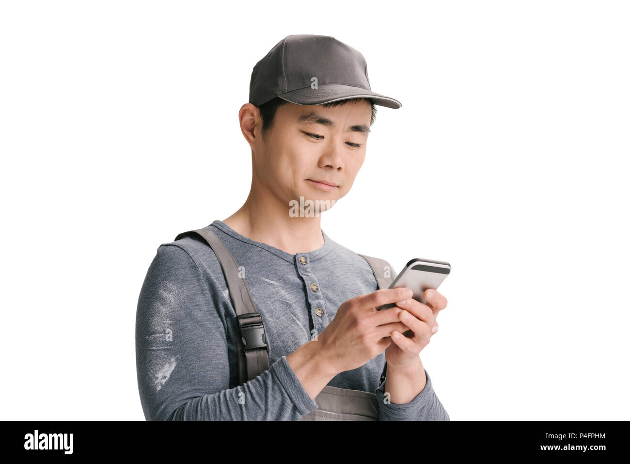 asian construction worker using smartphone isolated on white Stock ...