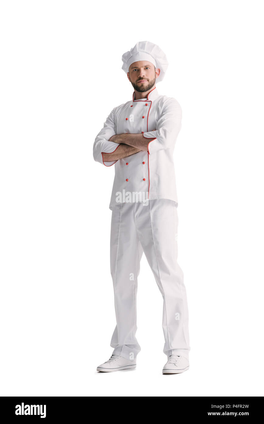 young pensive chef with folded arms isolated on white Stock Photo - Alamy