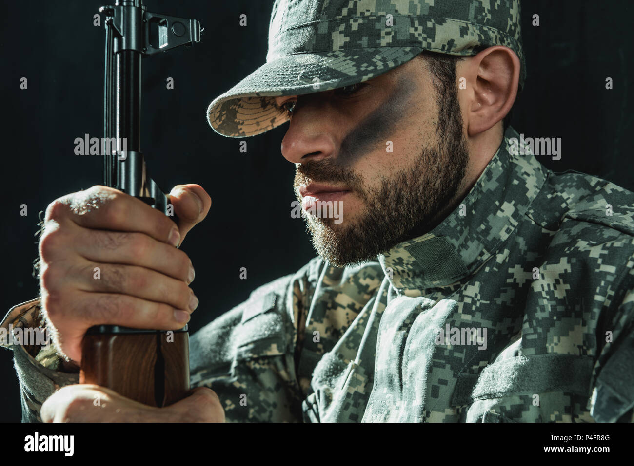 close-up shot of soldier in military uniform with rifle isolated on ...