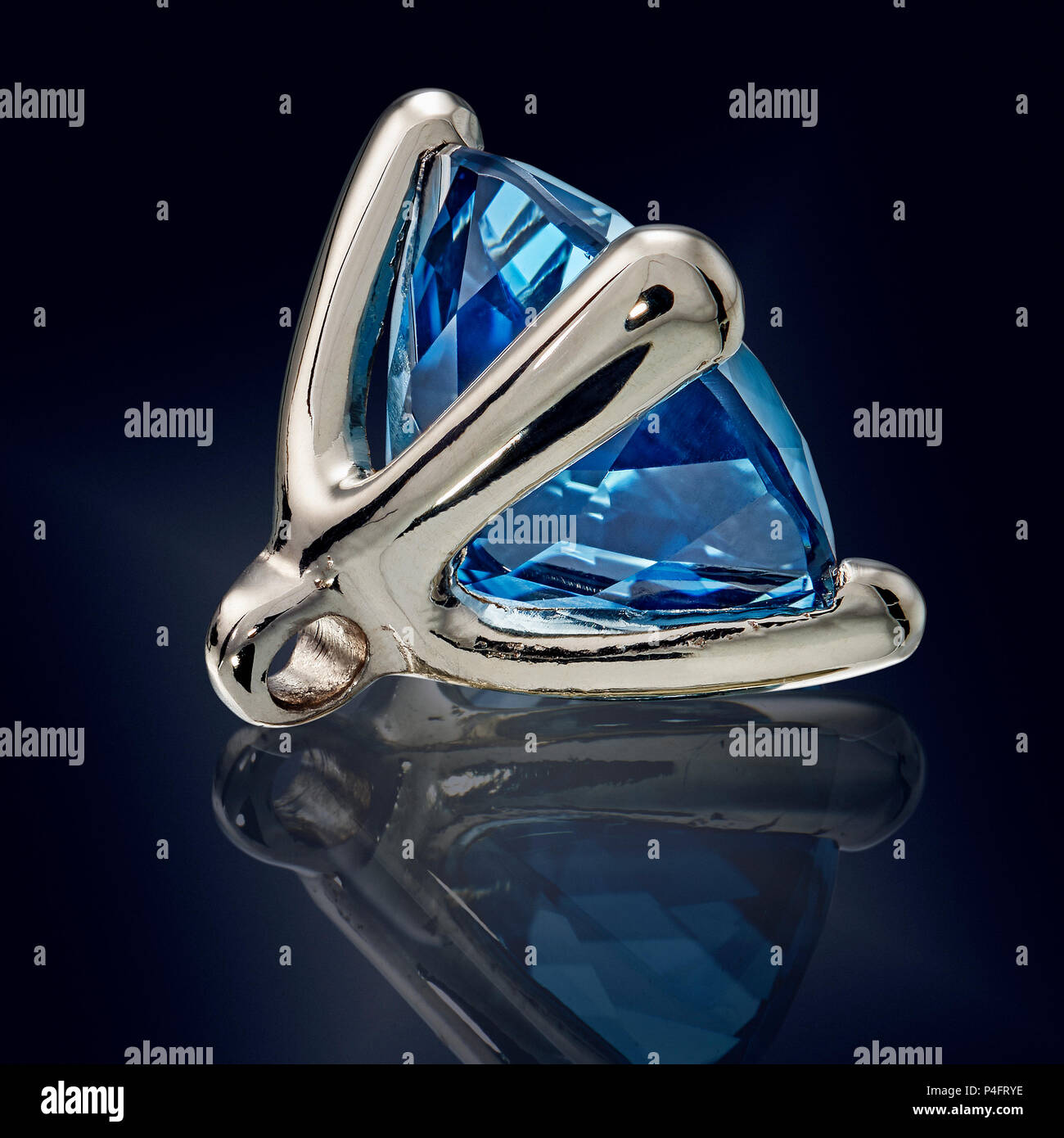 topaz london gem stone in golden setting isolated Stock Photo - Alamy