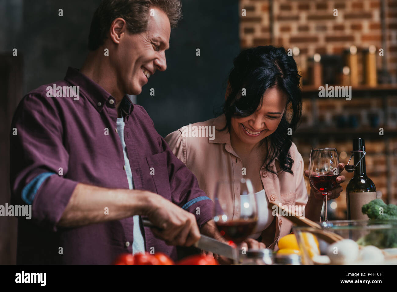 Couple cooking dinner hi-res stock photography and images - Alamy