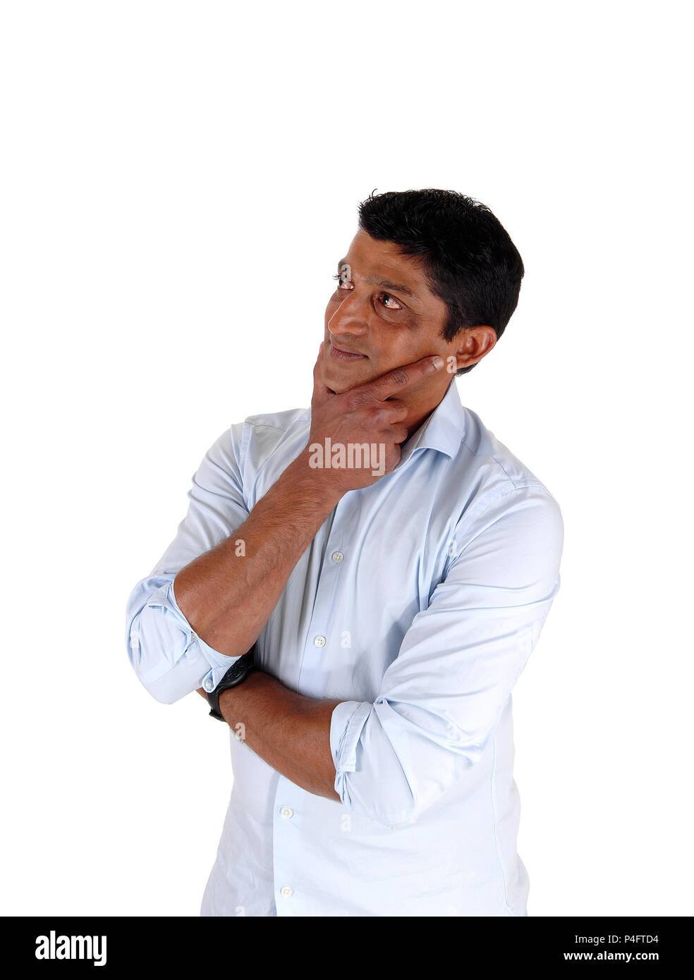 A close up image of a very serious man with his hand on his chin ...