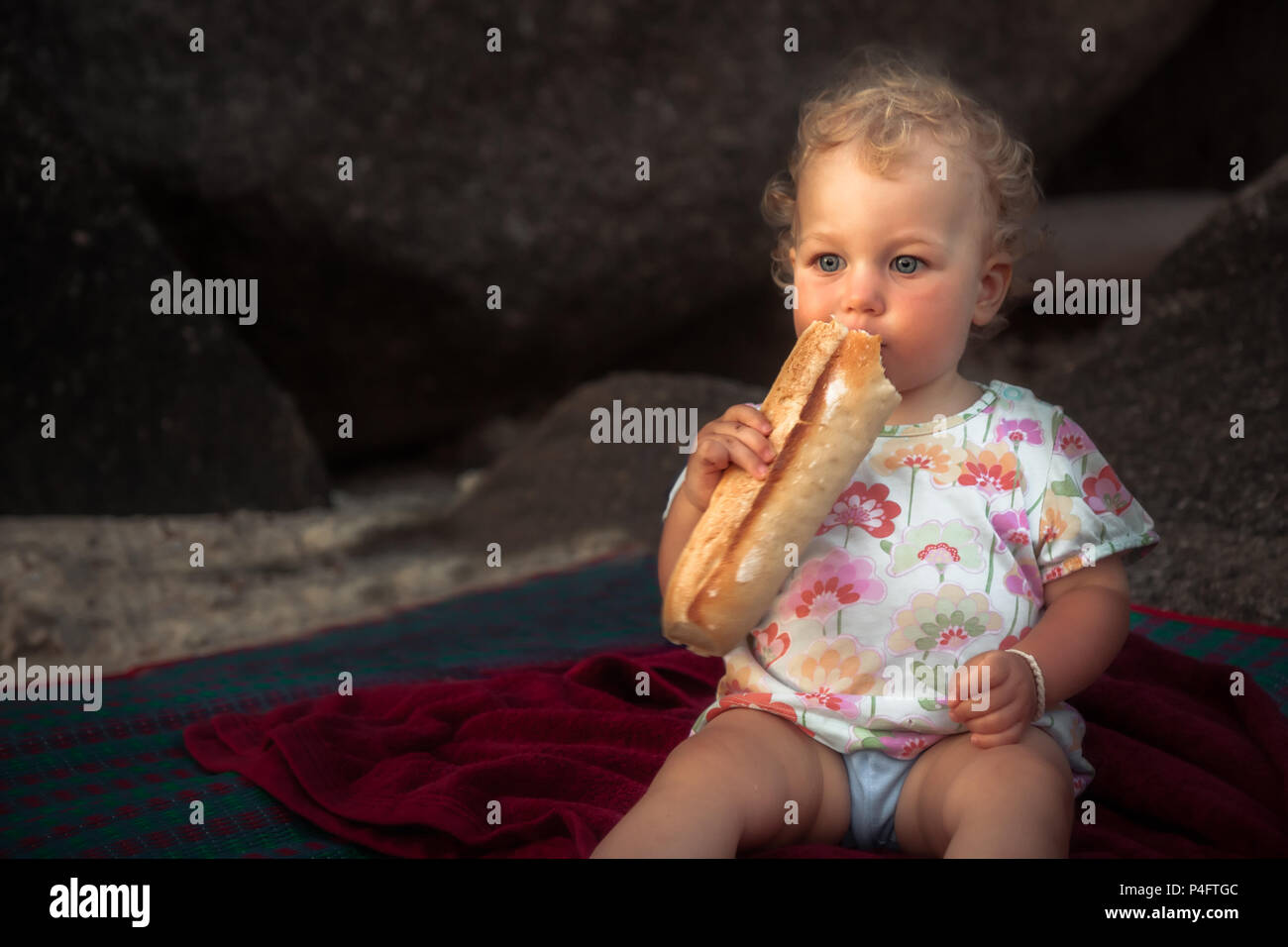Kid eating bread hi-res stock photography and images - Alamy