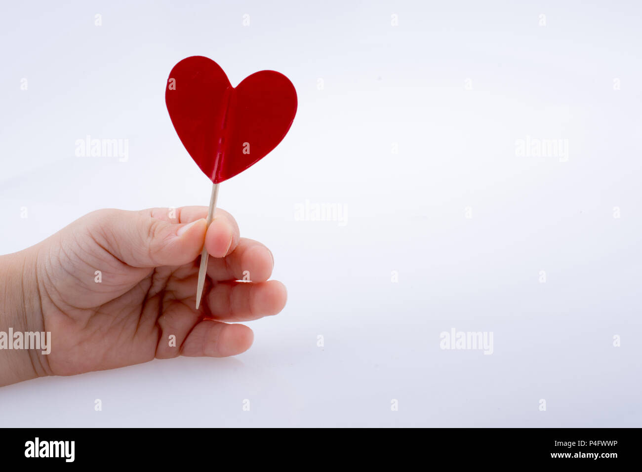 Hand holding a honey stick hi-res stock photography and images - Alamy