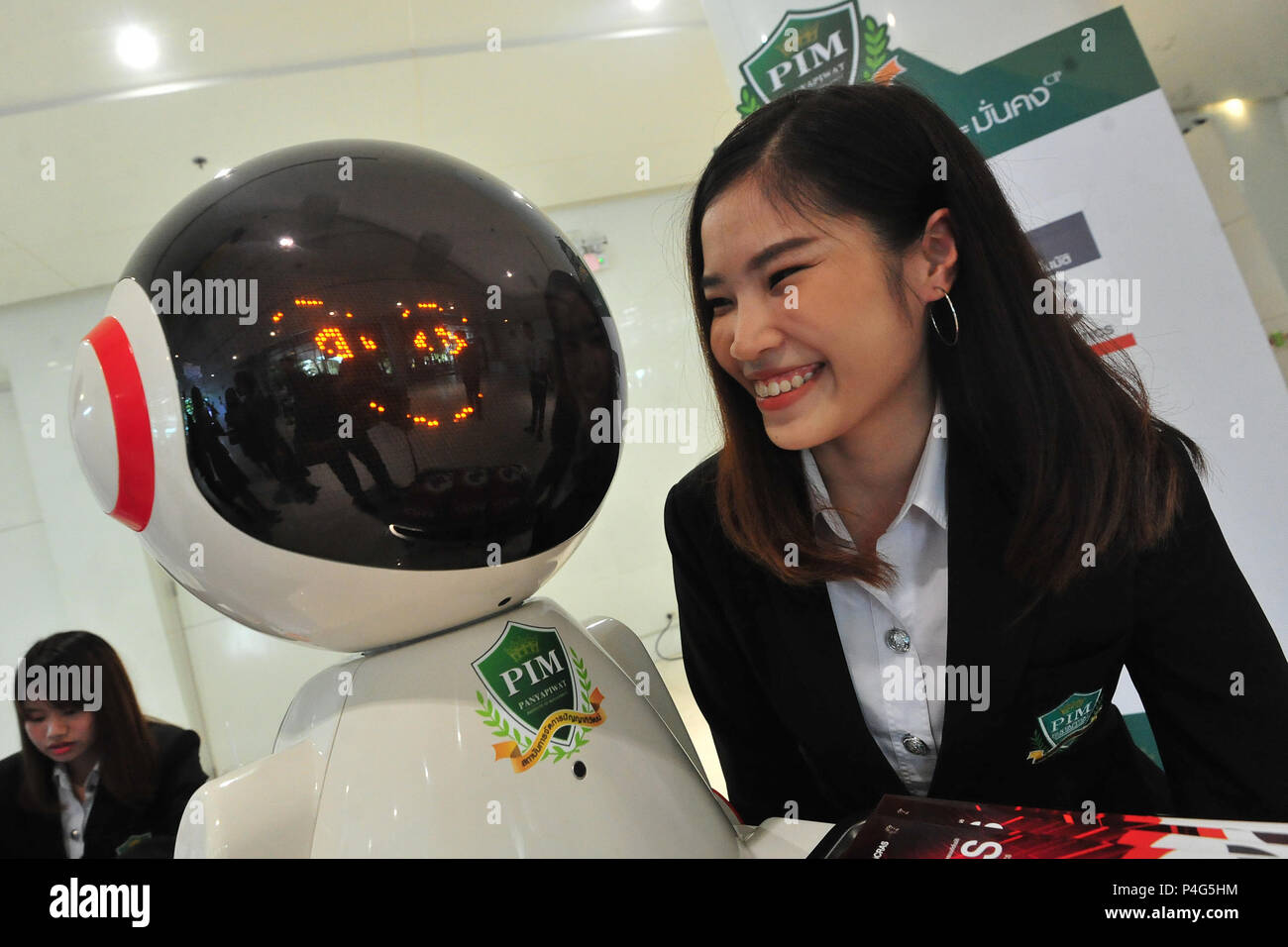 Bangkok, Thailand. 22nd June, 2018. A student watches a robot called ...