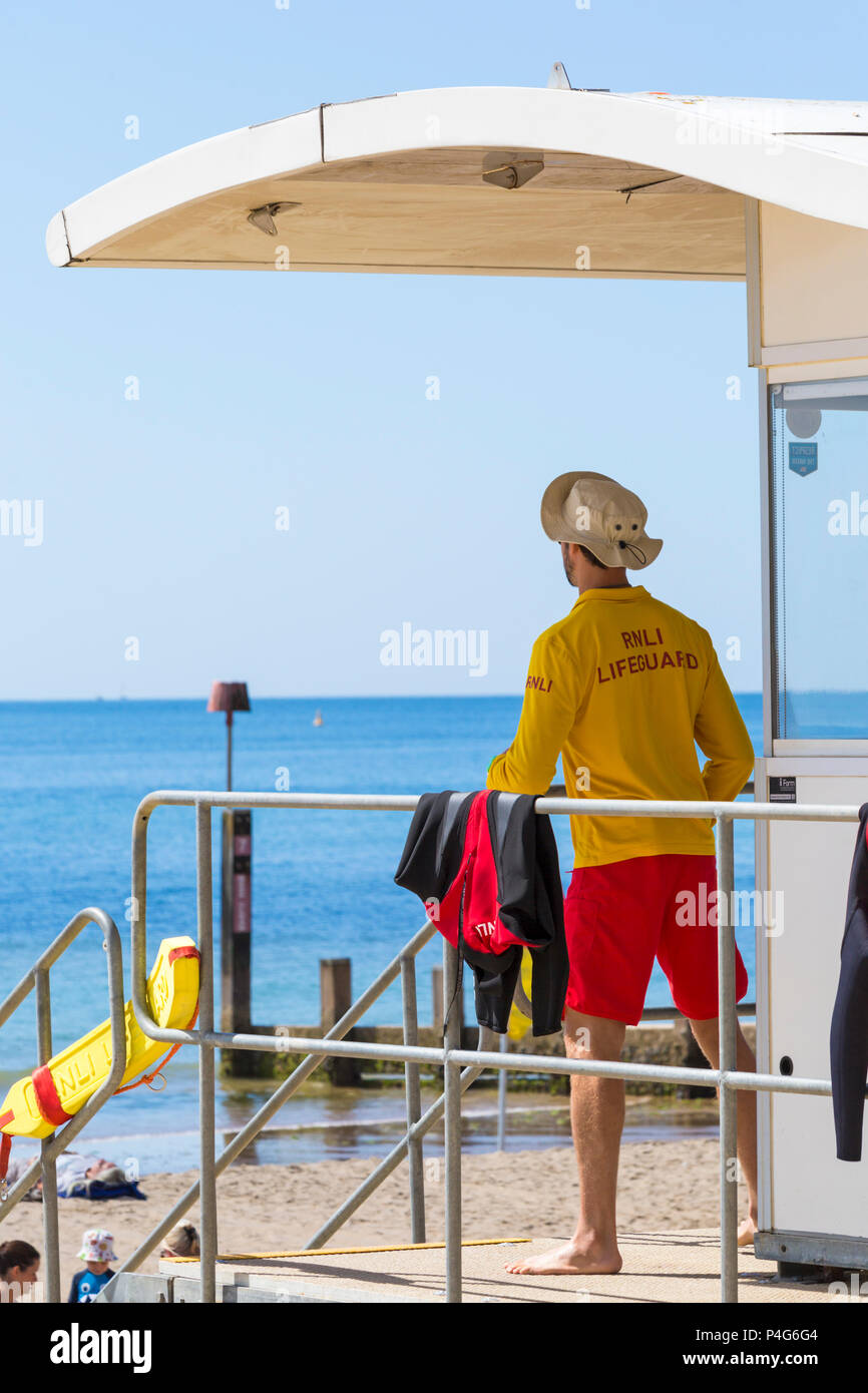 Lifeguard keeping a lookout lifeguard keeping a look out hi-res stock ...