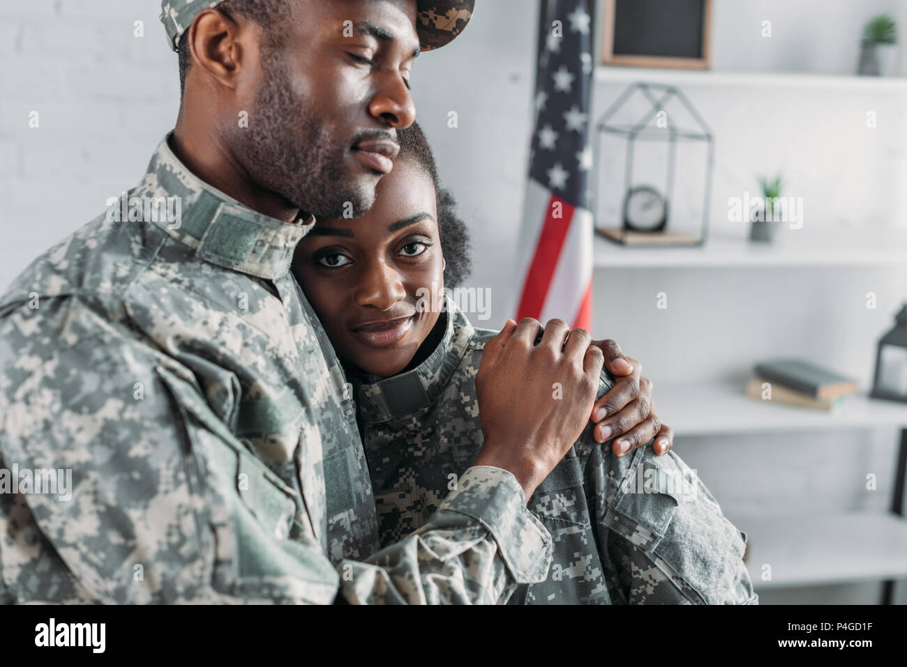 African american female and male soldiers embracing together Stock ...