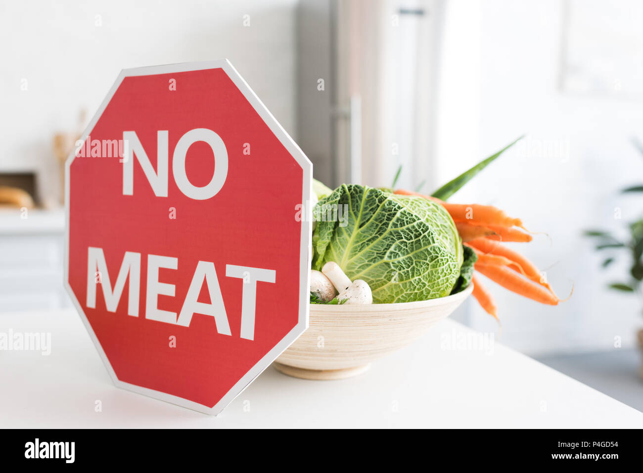 no meat sign and bowl with vegetables on kitchen counter Stock Photo ...