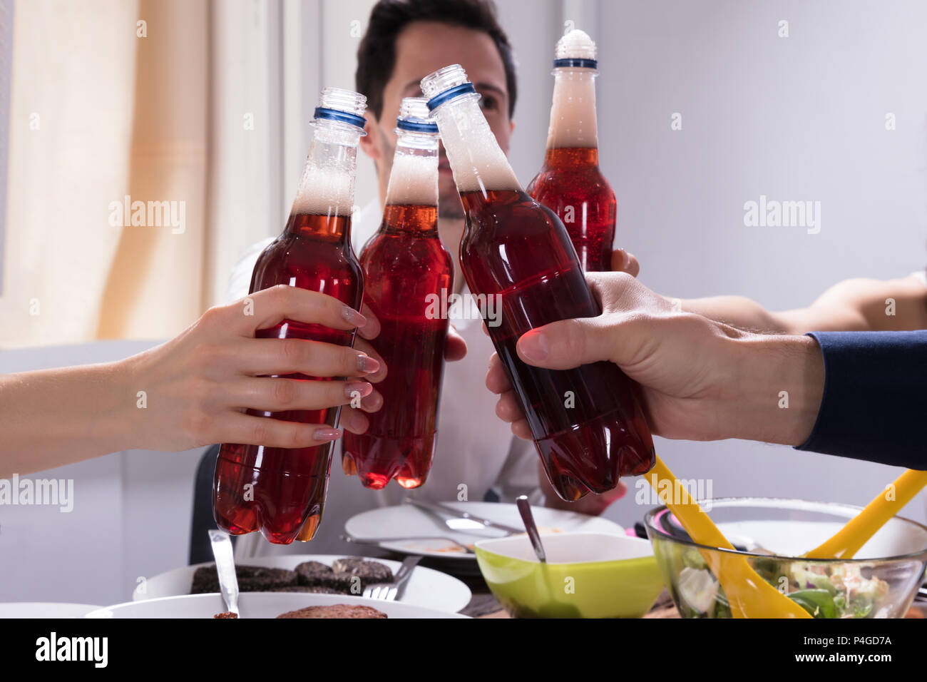 Group Of Happy Young Friends Celebrating With Bottle Of Lemonade Drink ...