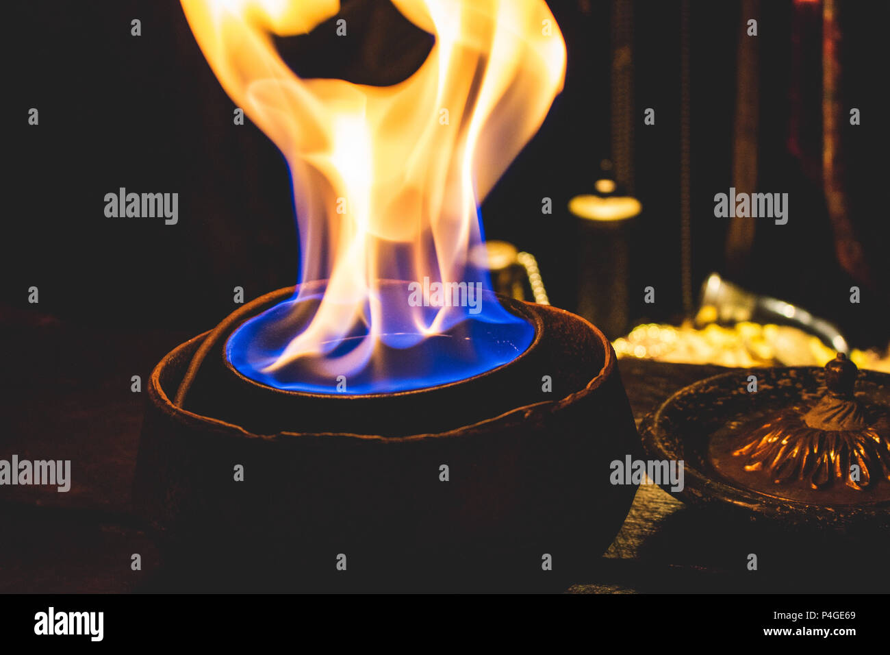 Flame bowl illuminating the temple Stock Photo - Alamy