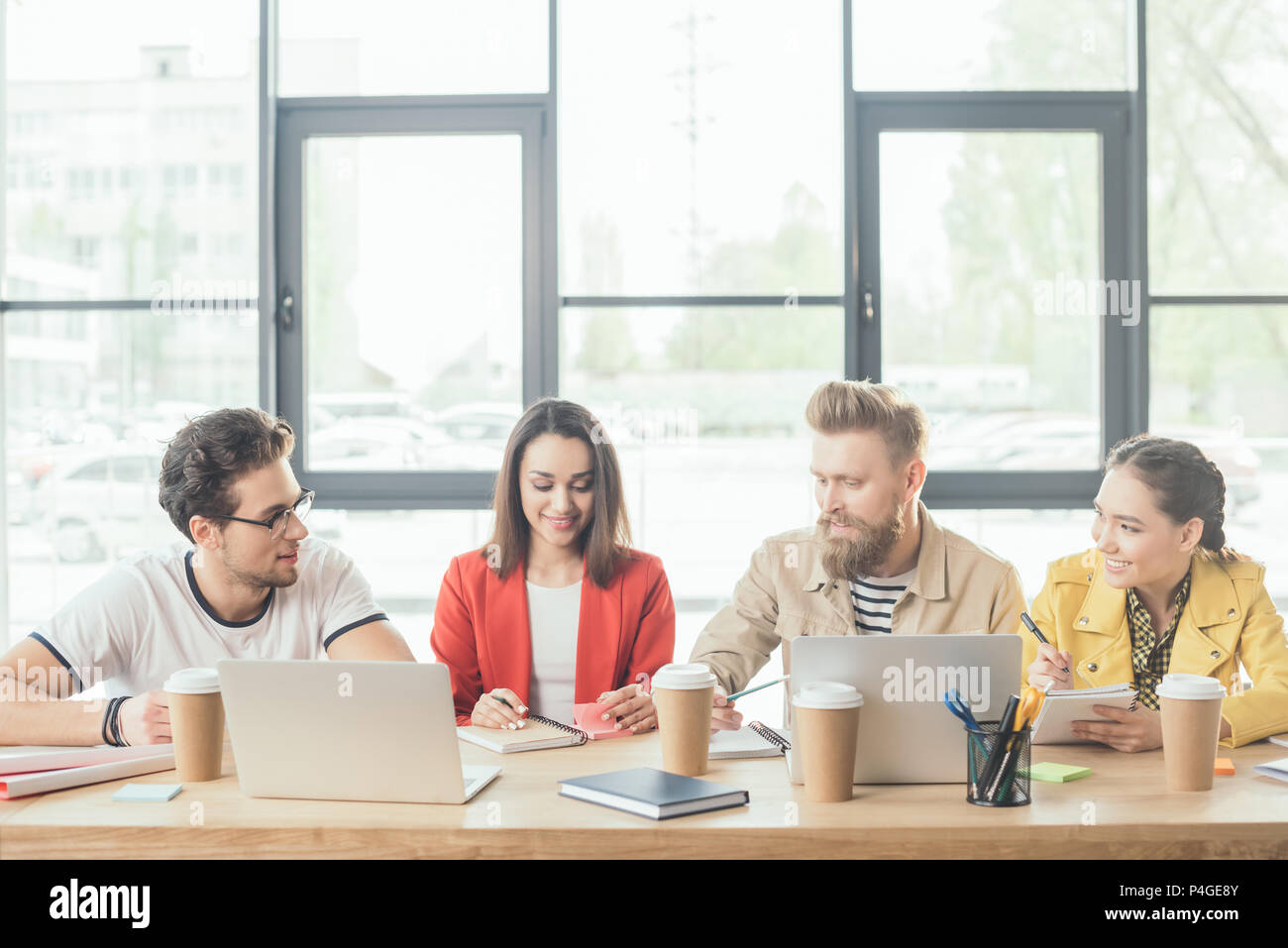 Team working on laptops in hi-res stock photography and images - Alamy