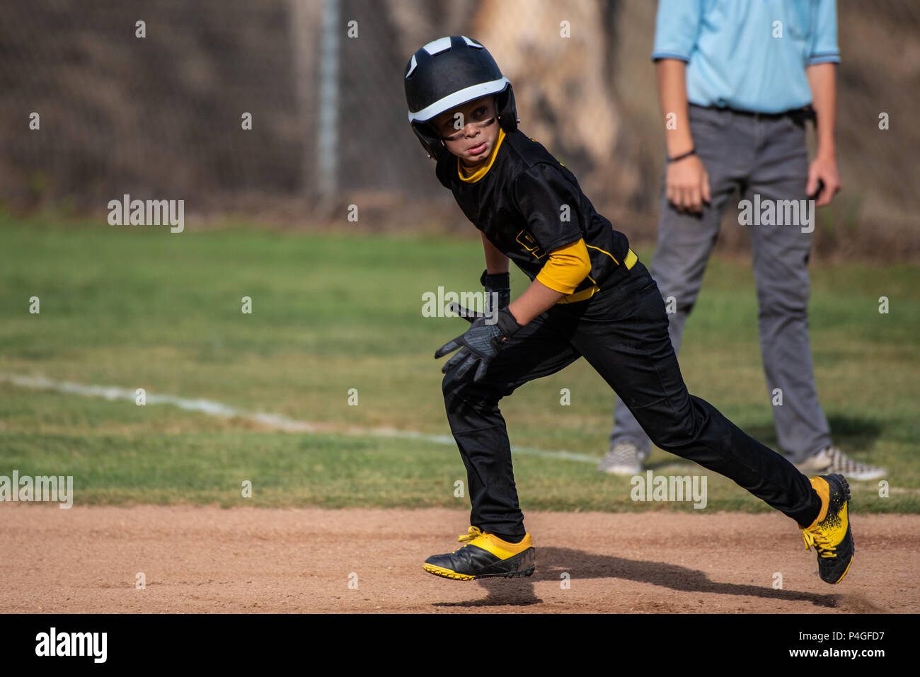 Baseball player running over base hi-res stock photography and images ...