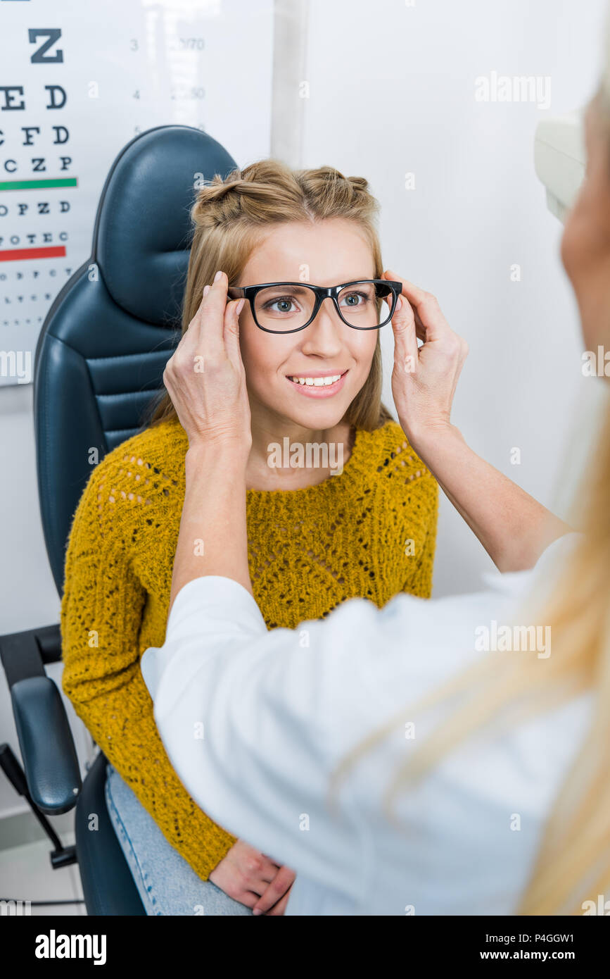 oculist and patient trying new glasses in clinic Stock Photo - Alamy