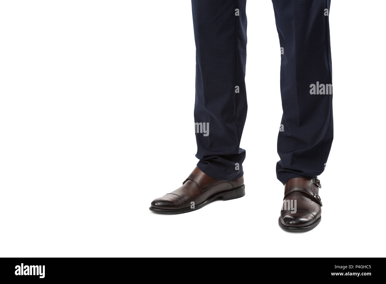 low section of businessman legs in shoes and suit, isolated on white ...