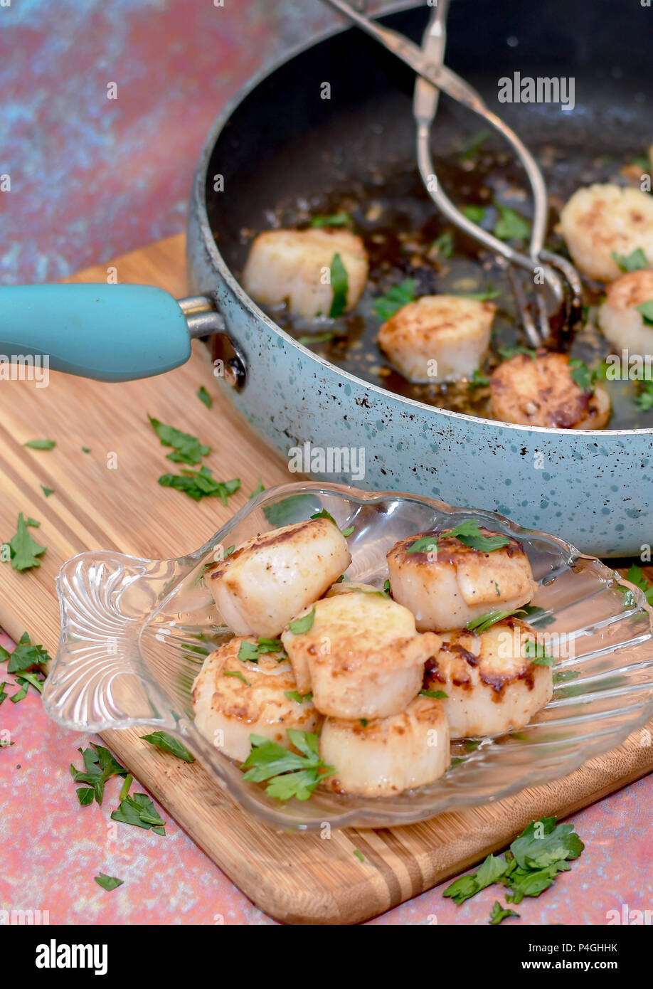 Preparing and plating Sea scallops Stock Photo - Alamy