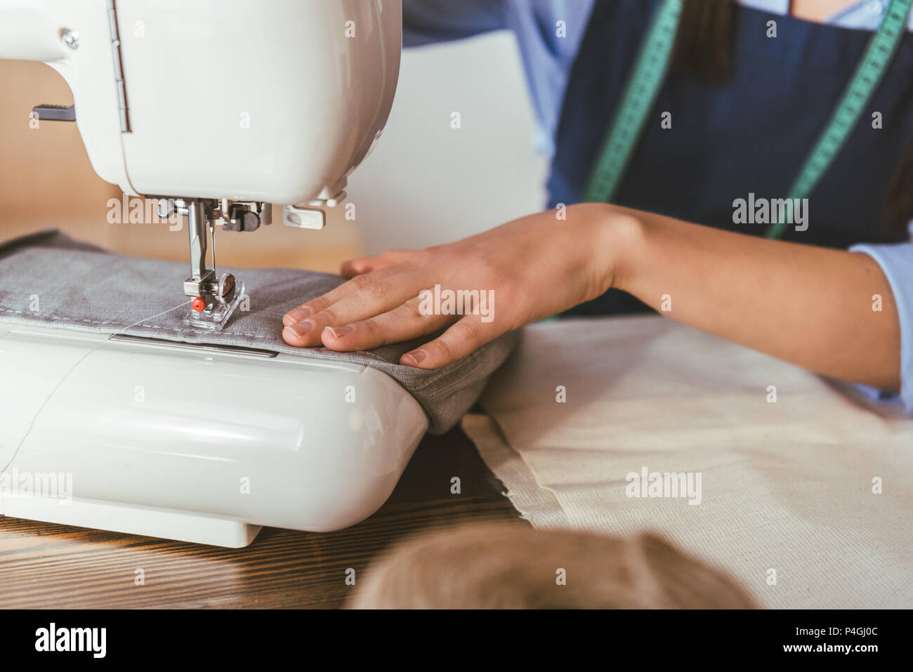 cropped image of seamstress sewing with sewing machine Stock Photo - Alamy