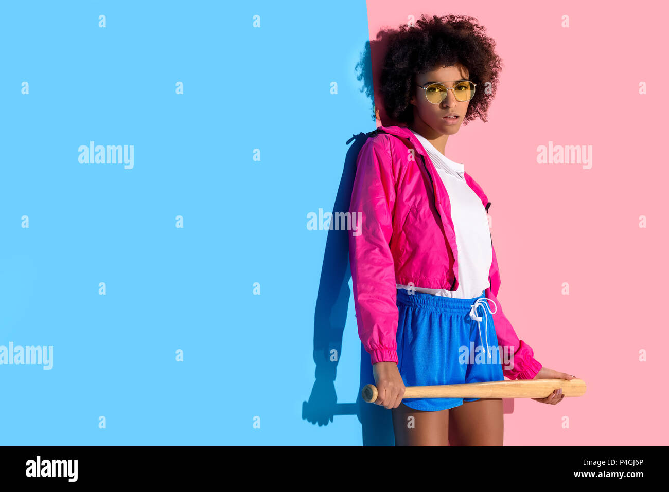 Young bright african american girl holding baseball bat Stock Photo - Alamy