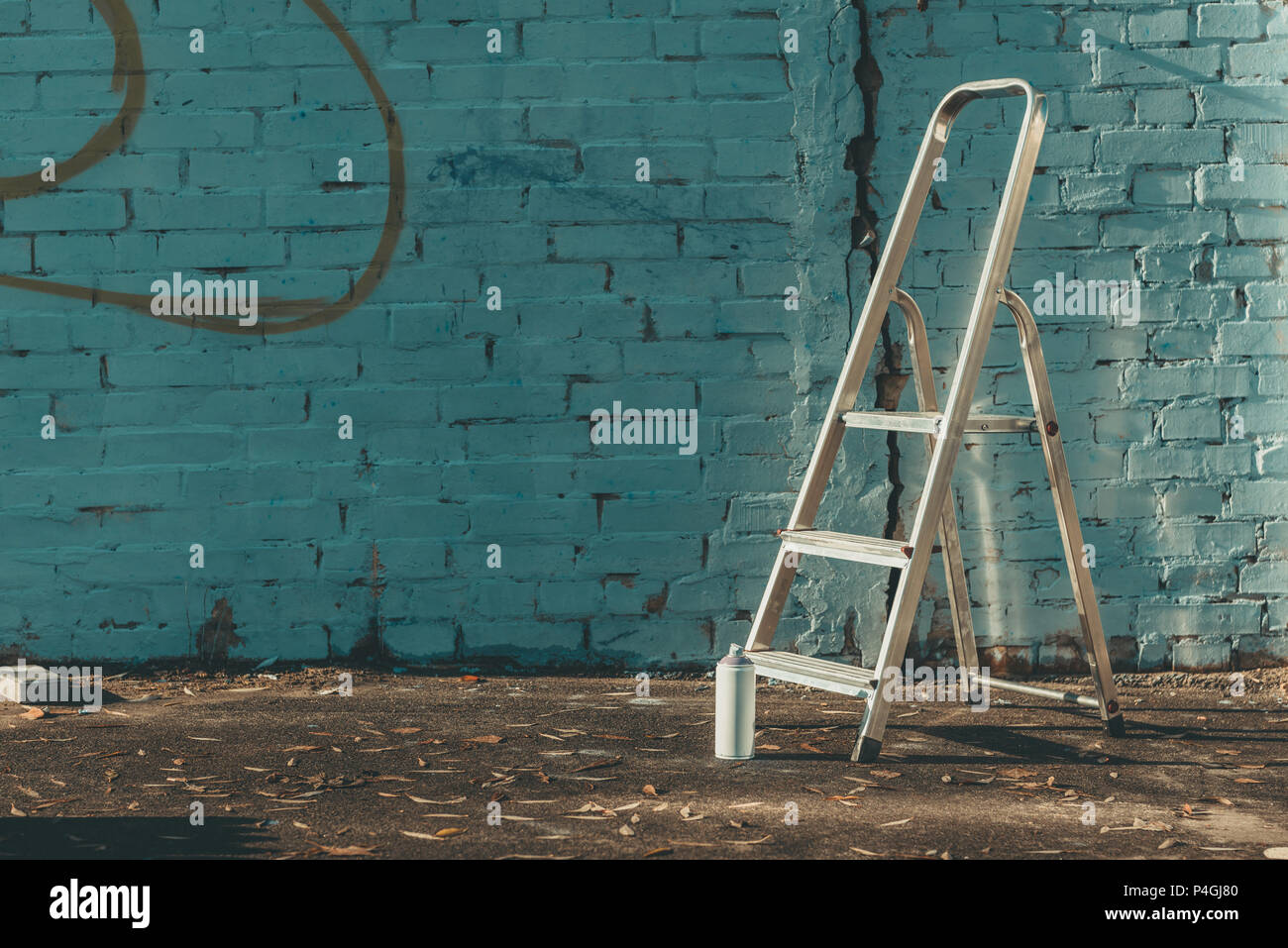 ladder and can with colorful spray paint near wall Stock Photo - Alamy