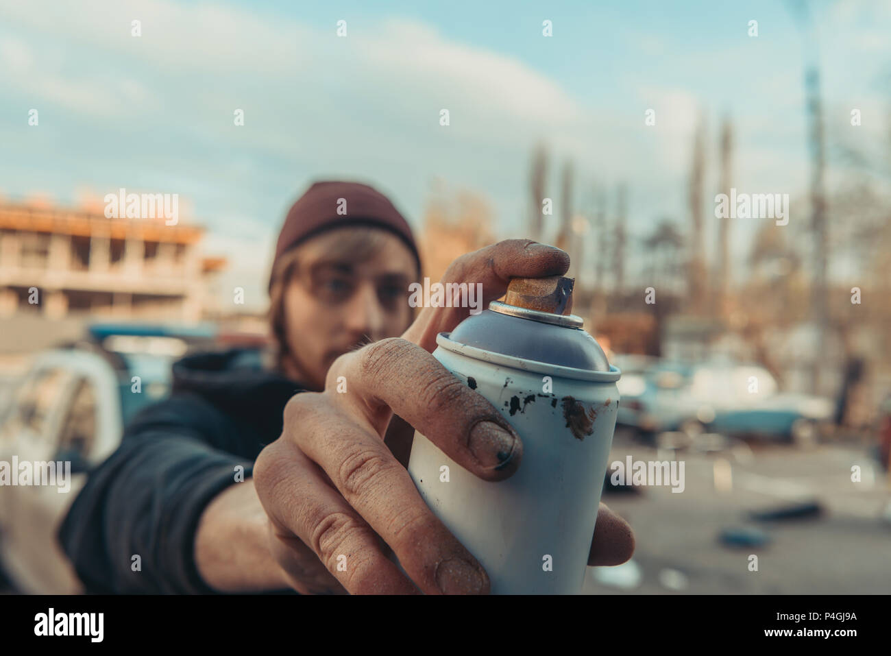 selective focus of street artist painting colorful graffiti Stock Photo ...