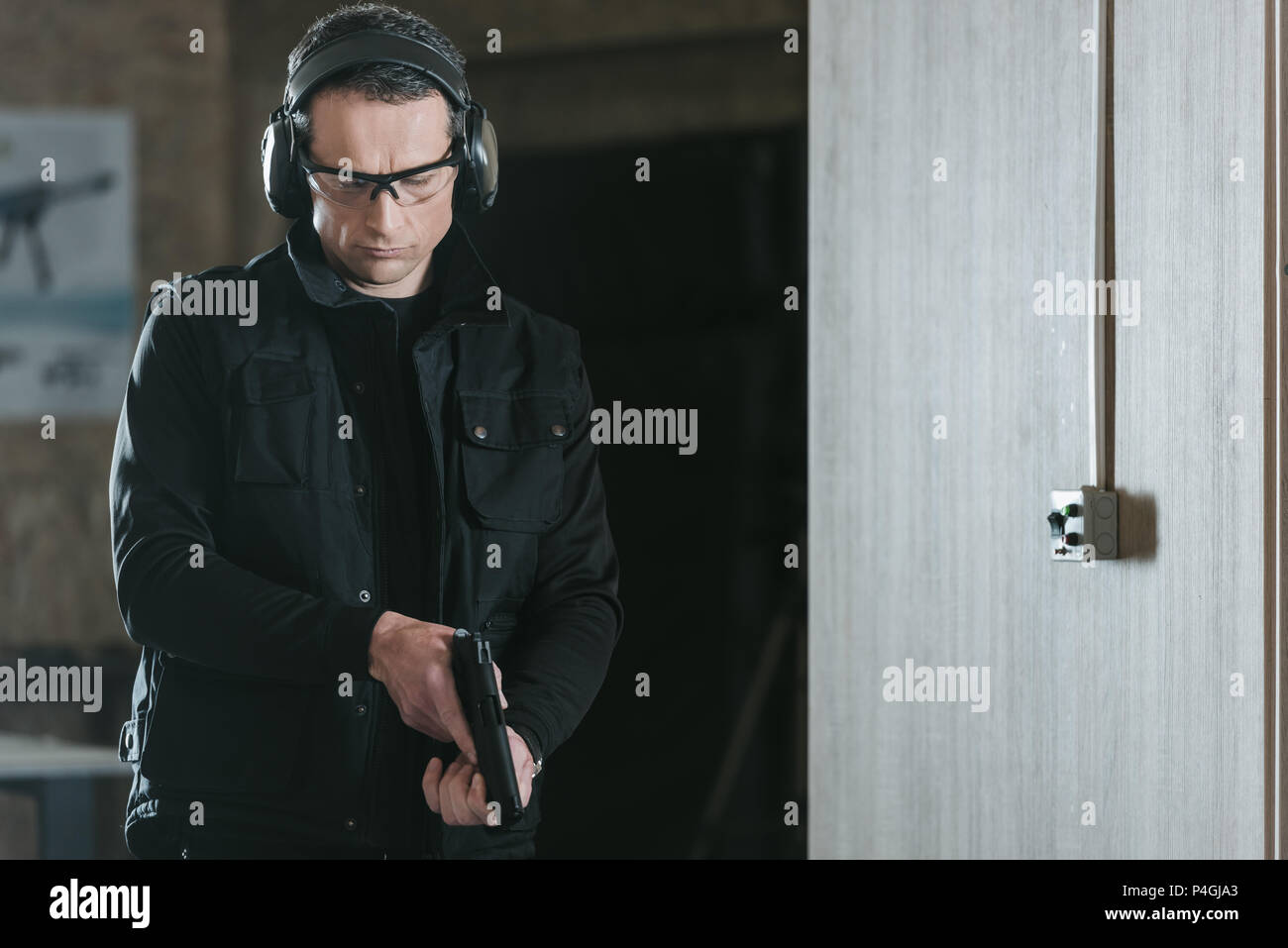 Looking at gun hi-res stock photography and images - Alamy