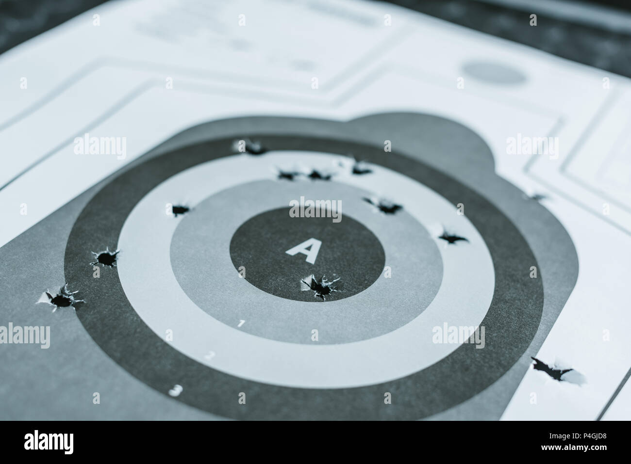 close up of used gun target with holes after bullets Stock Photo - Alamy