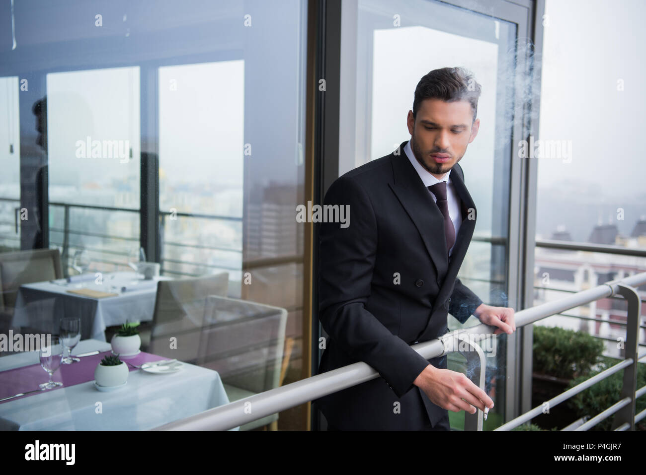 Cigarette smoke balcony hi-res stock photography and images - Alamy