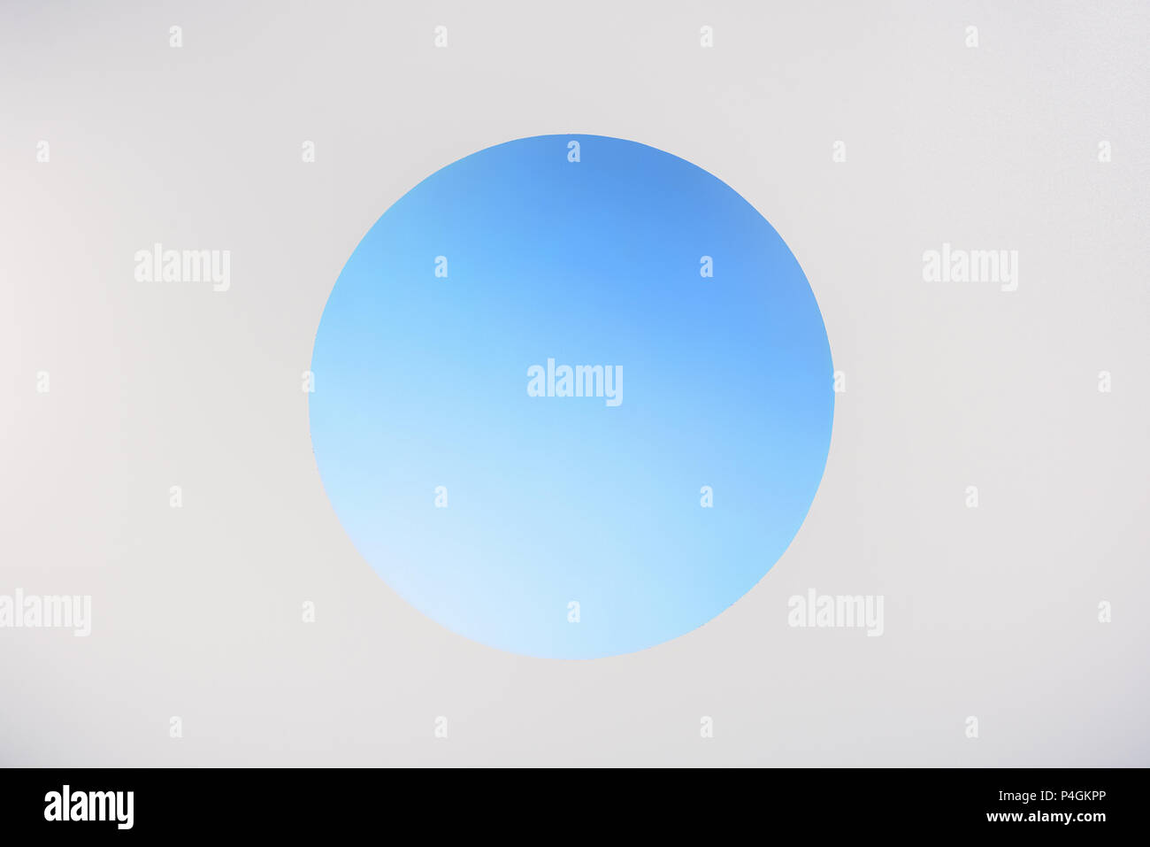 round blue hole with copy space on grey Stock Photo - Alamy