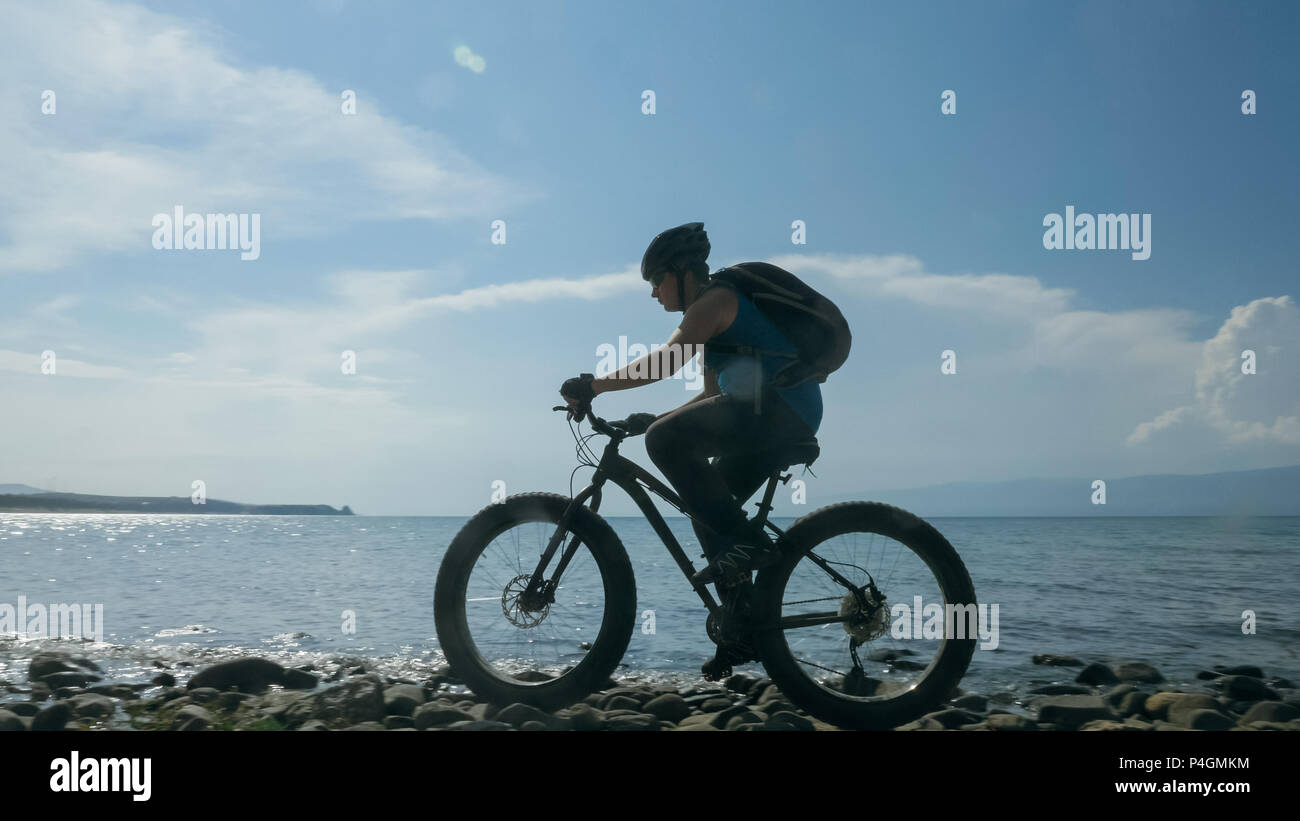 Fat bike also called fatbike or fat-tire bike in summer driving on the ...